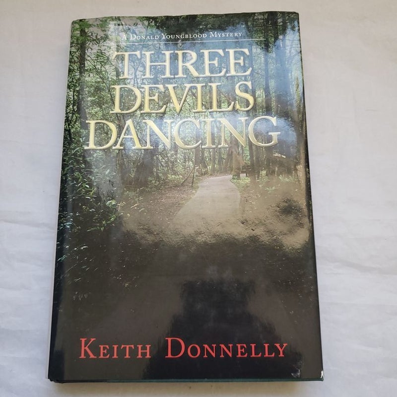 Three Devils Dancing by Keith Donnelly, Hardcover | Pangobooks