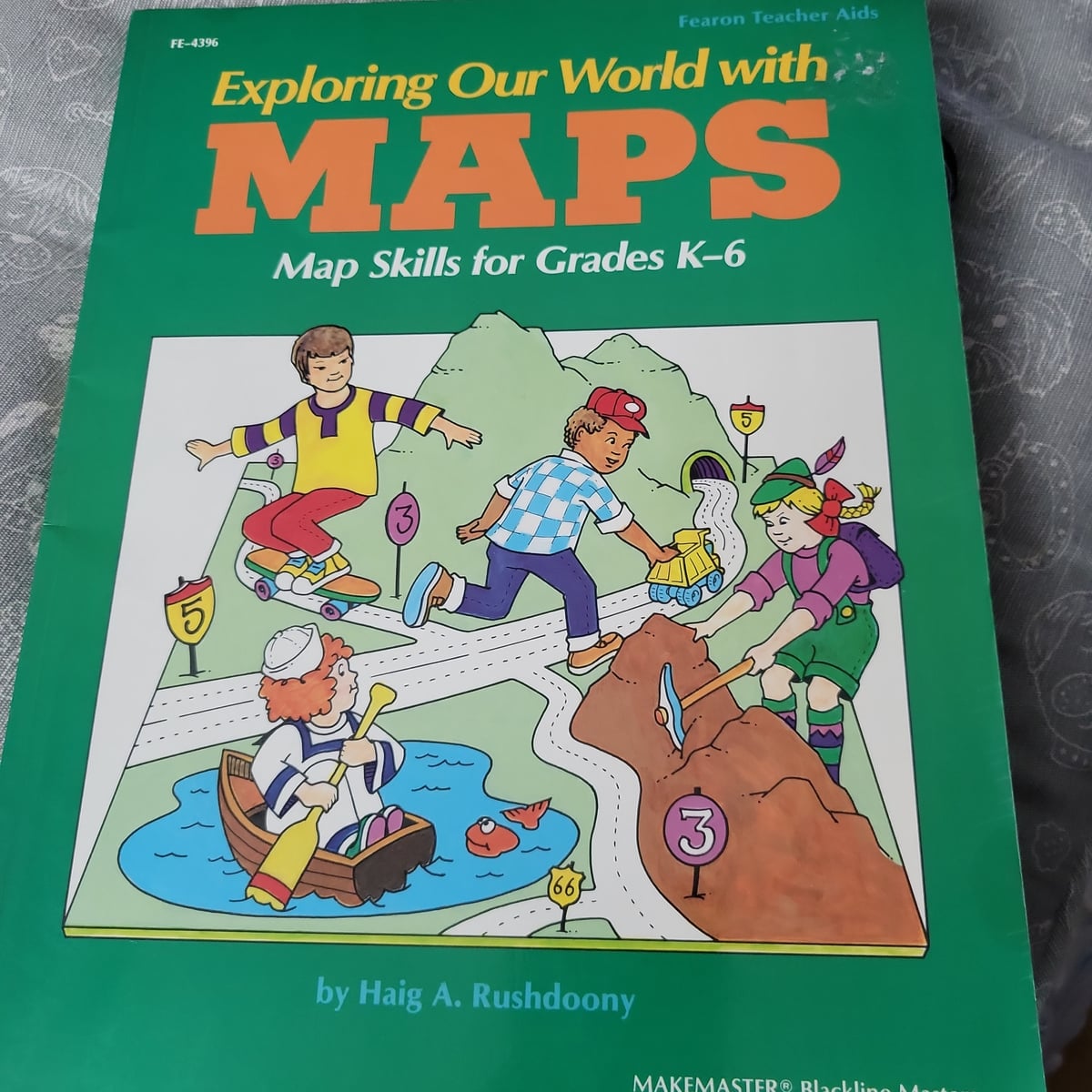 Exploring Our World With Maps by Haig A. Rushdoony