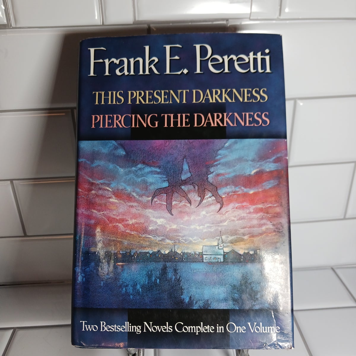 This Present Darkness and Piercing the Darkness by Frank E. Peretti