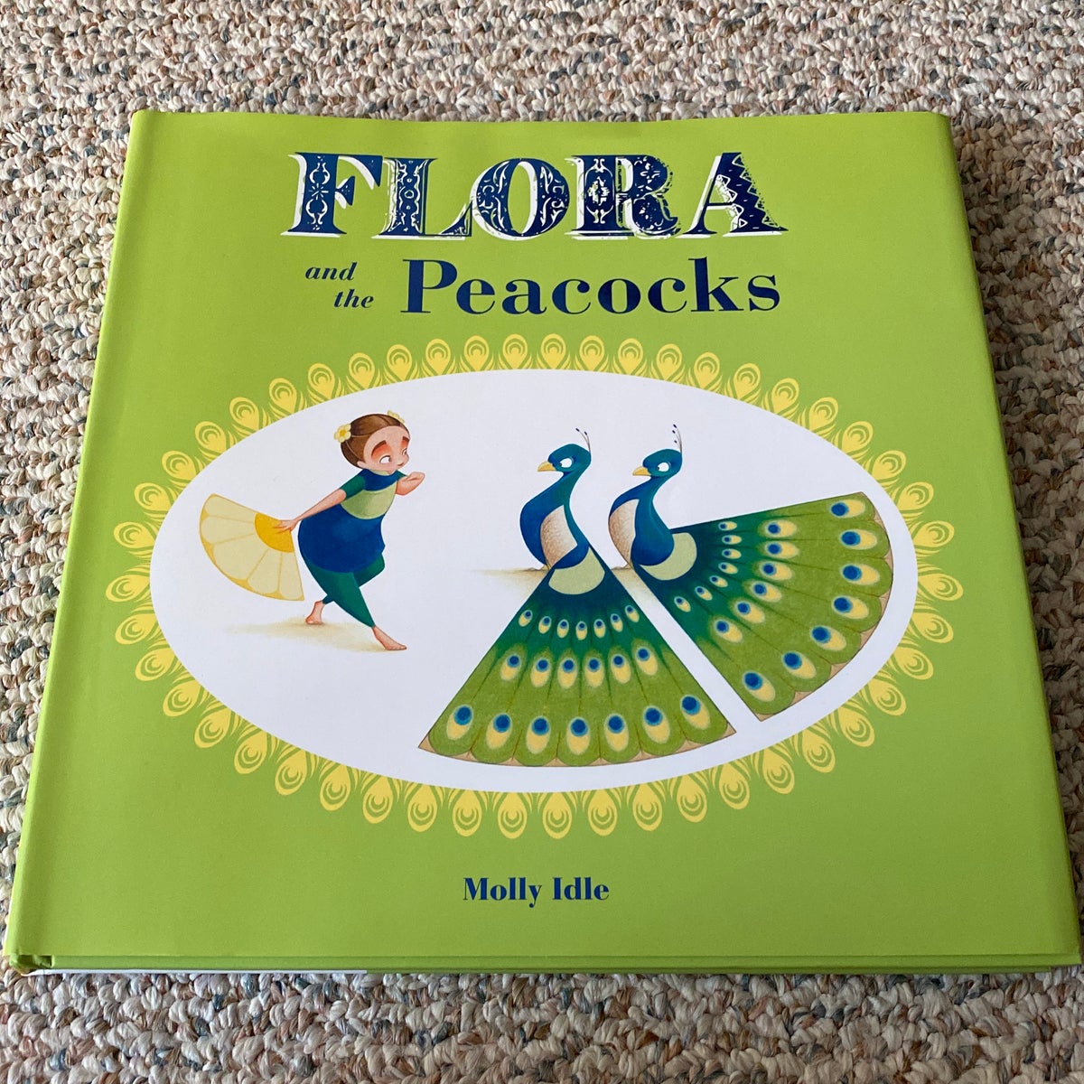 Flora and the Peacocks by Molly Idle