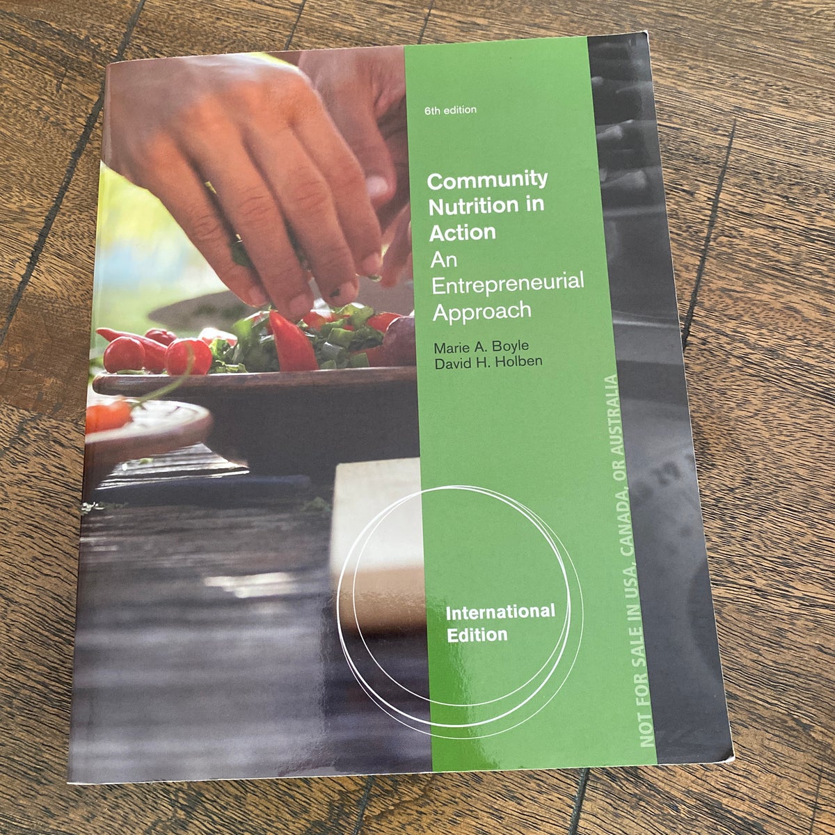 Community Nutrition in Action by Marie A. Boyle, David H. Holben