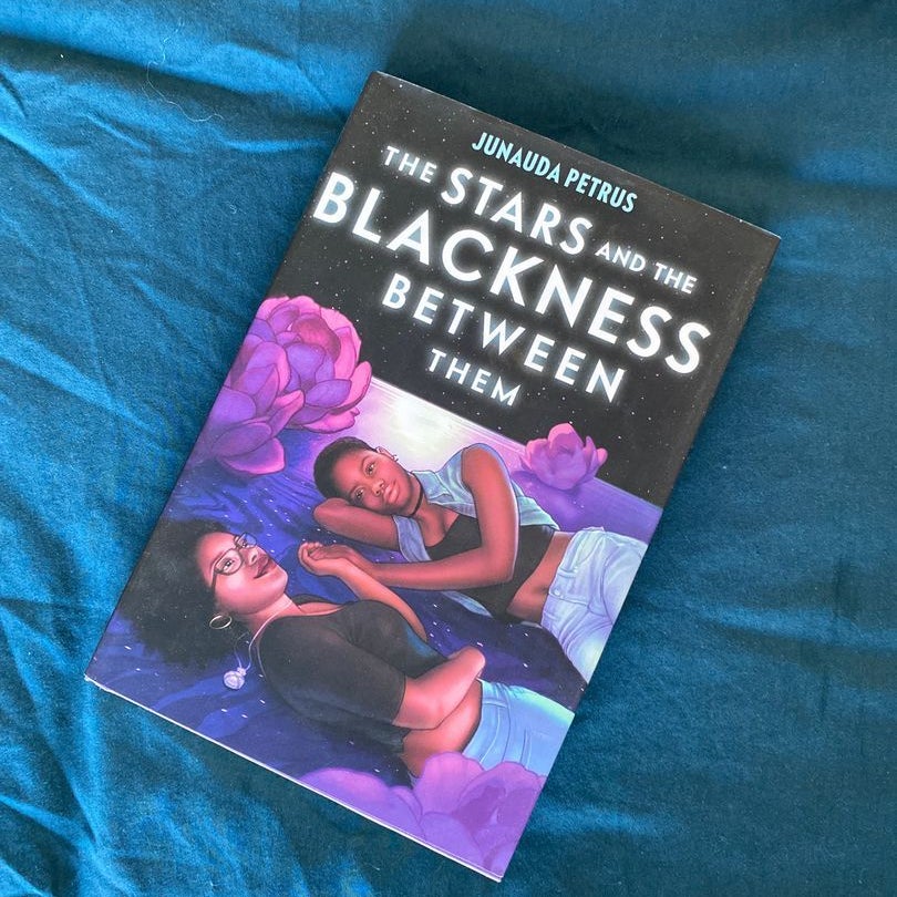 The Stars and the Blackness Between Them by Junauda Petrus
