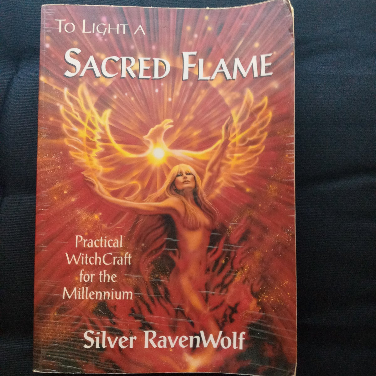 To Light a Sacred Flame by Silver RavenWolf