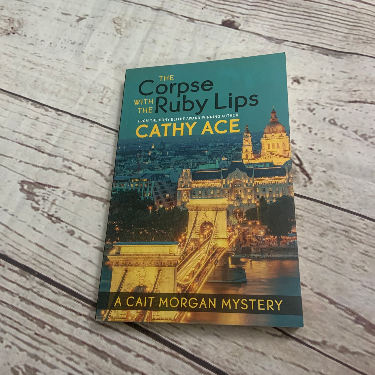 The Corpse with the Ruby Lips by Cathy Ace, Paperback | Pangobooks