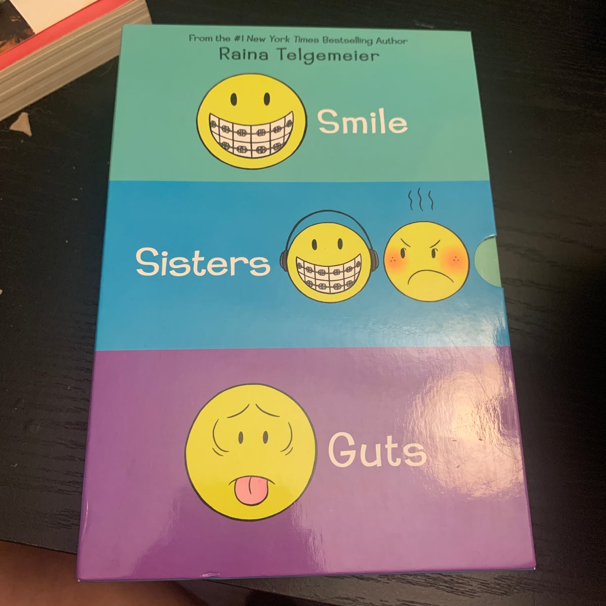 Smile, Sisters, and Guts by Raina Telgemeier