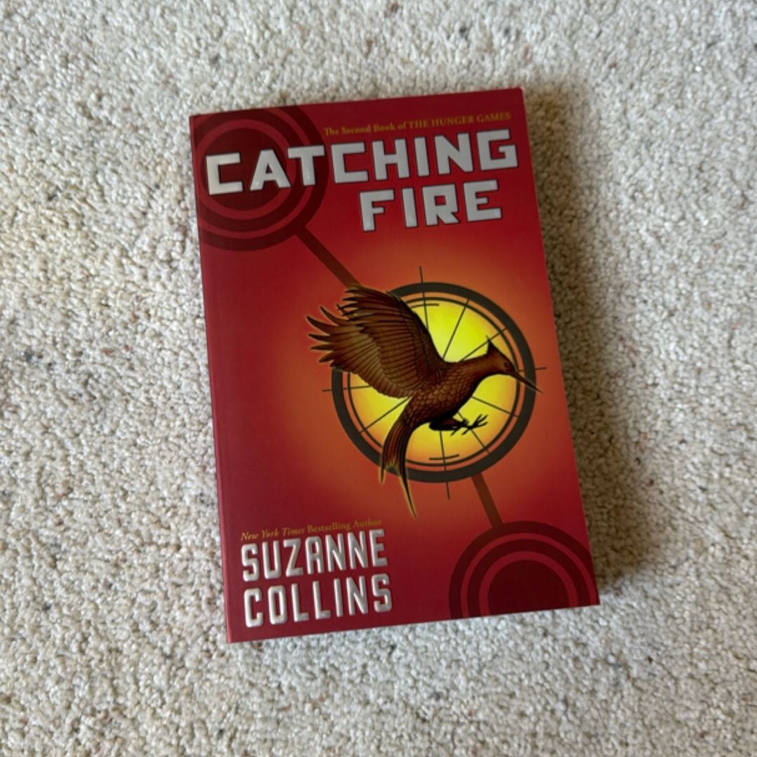 Catching Fire by Suzanne Collins, Paperback | Pangobooks
