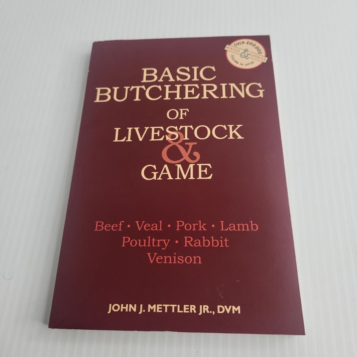 Basic Butchering of Livestock and Game by John J. Mettler