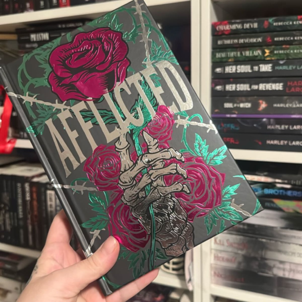 Afflicted by , Hardcover | Pangobooks