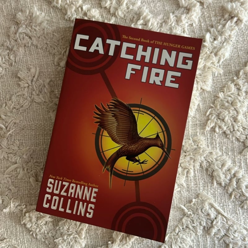 Catching Fire by Suzanne Collins, Paperback | Pangobooks