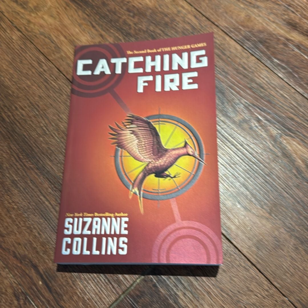 Catching Fire by Suzanne Collins, Paperback | Pangobooks