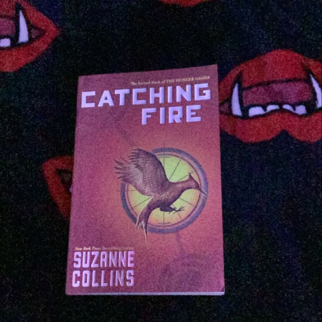 Catching Fire by Suzanne Collins, Paperback | Pangobooks