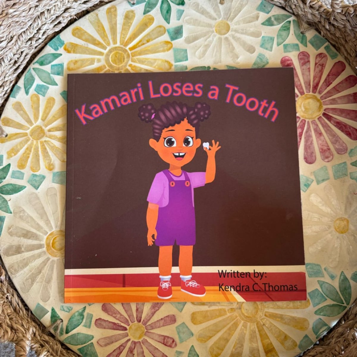 Kamari Loses a Tooth by Kendra Thomas