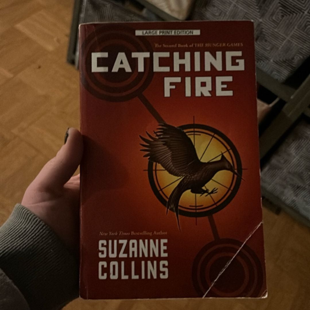 Catching Fire by Suzanne Collins, Paperback | Pangobooks