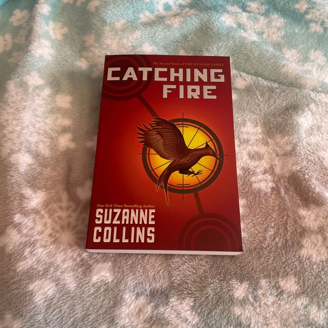 Catching Fire by Suzanne Collins, Paperback | Pangobooks
