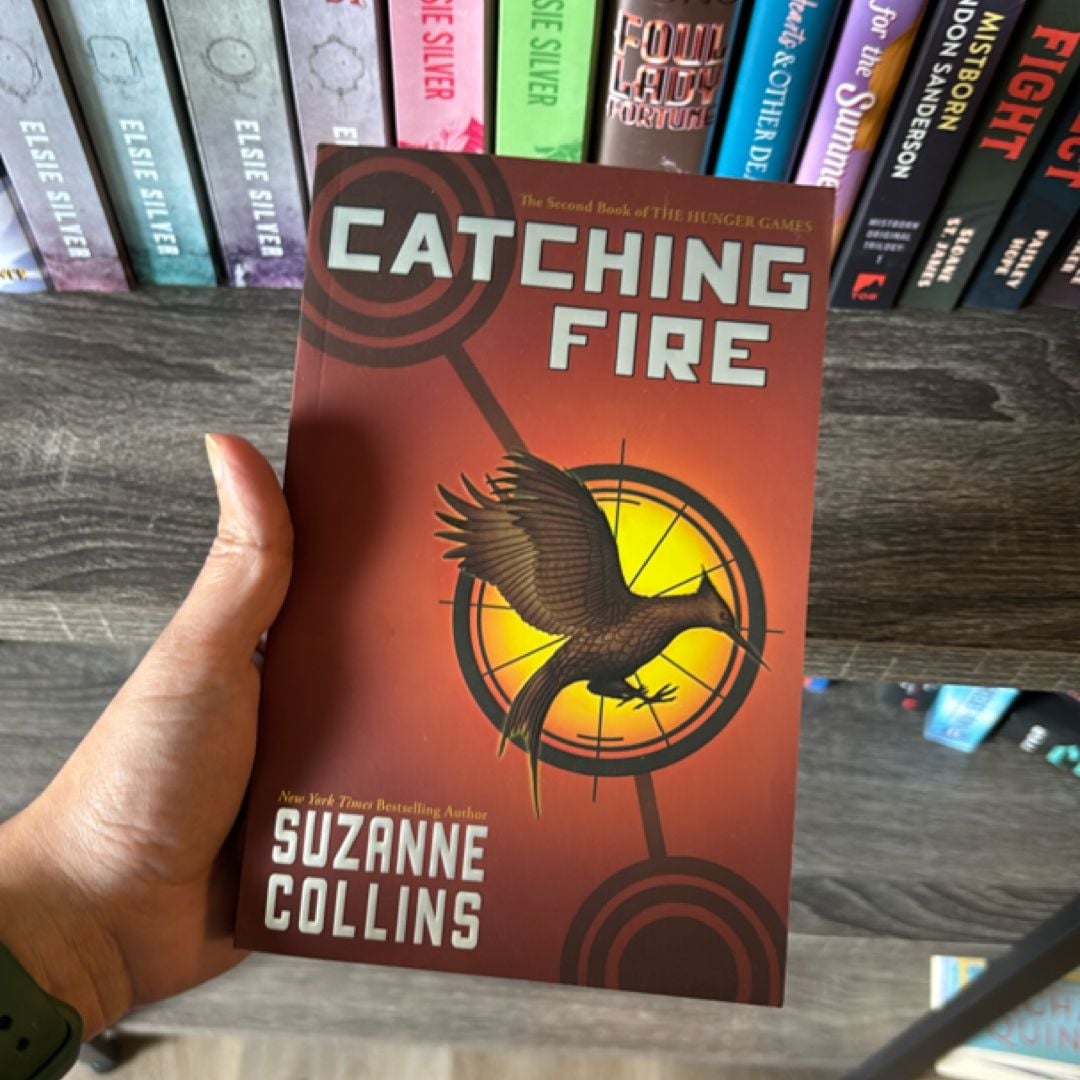 Catching Fire by Suzanne Collins, Paperback | Pangobooks