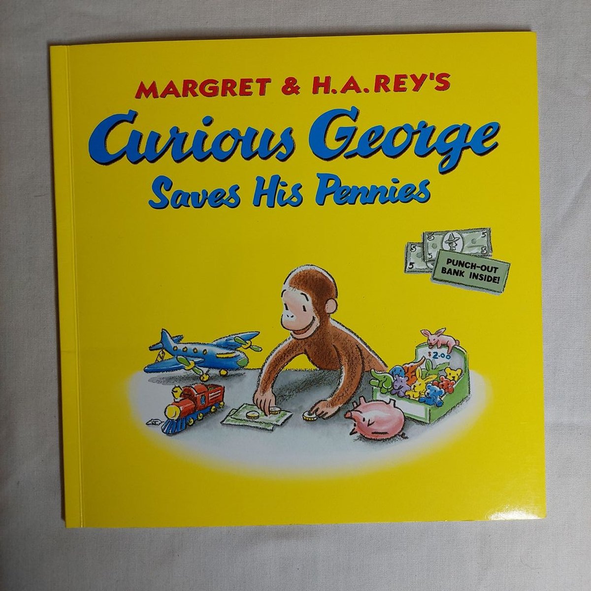 Curious George Saves His Pennies by undefined