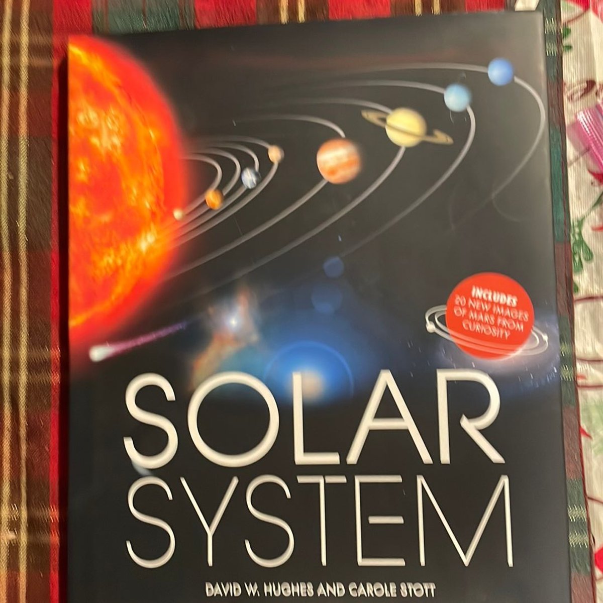 Solar System by Carole Stott, David H. Hughes