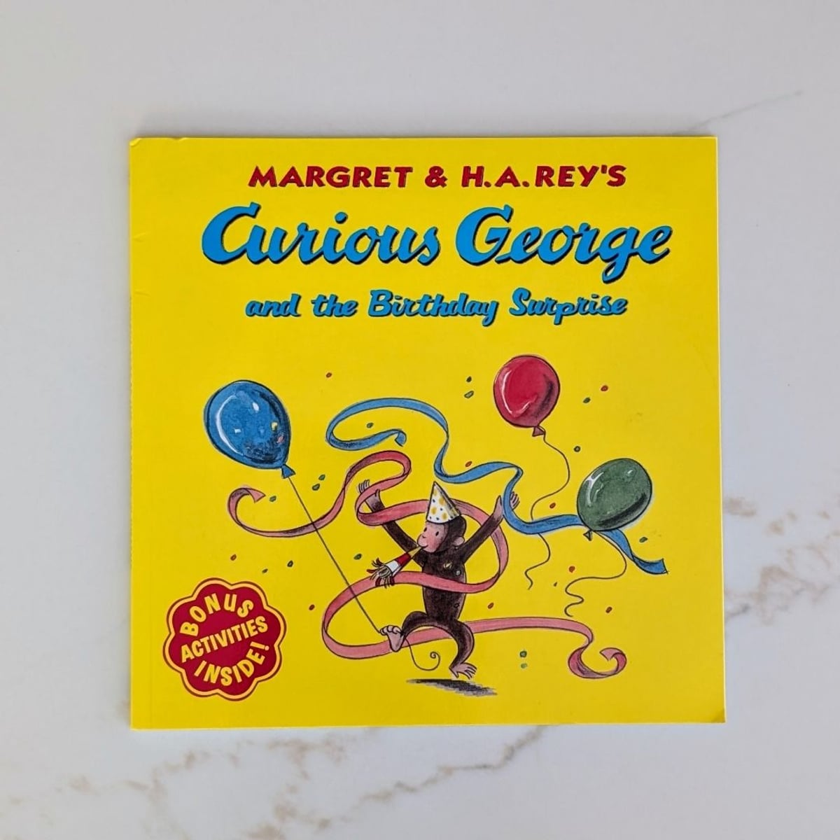 Curious George and the Birthday Surprise by H. A. Rey