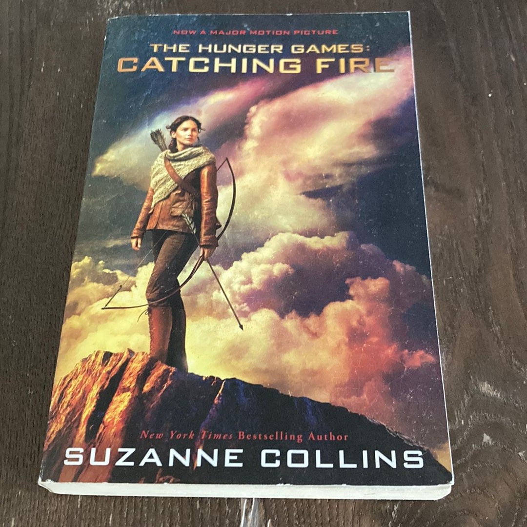 Catching Fire by Suzanne Collins, Paperback | Pangobooks