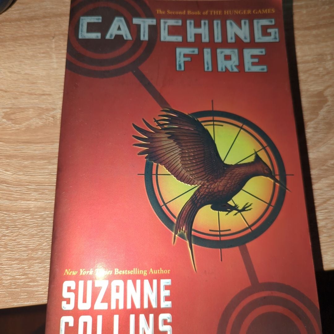 Catching Fire by Suzanne Collins, Paperback | Pangobooks