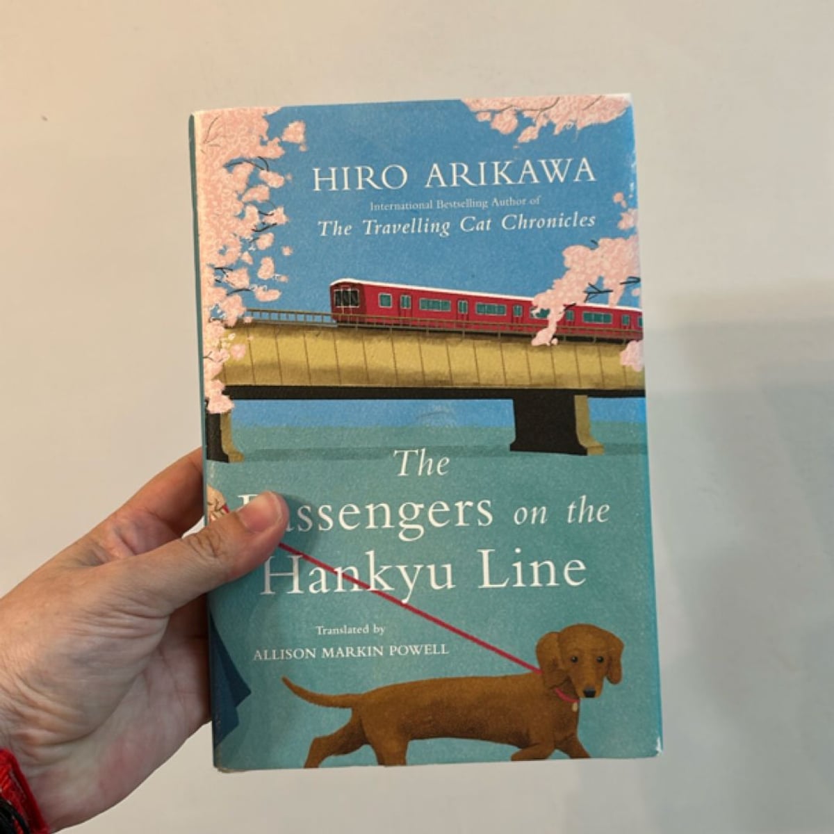 The Passengers on the Hankyu Line by Hiro Arikawa, Allison Markin Powell