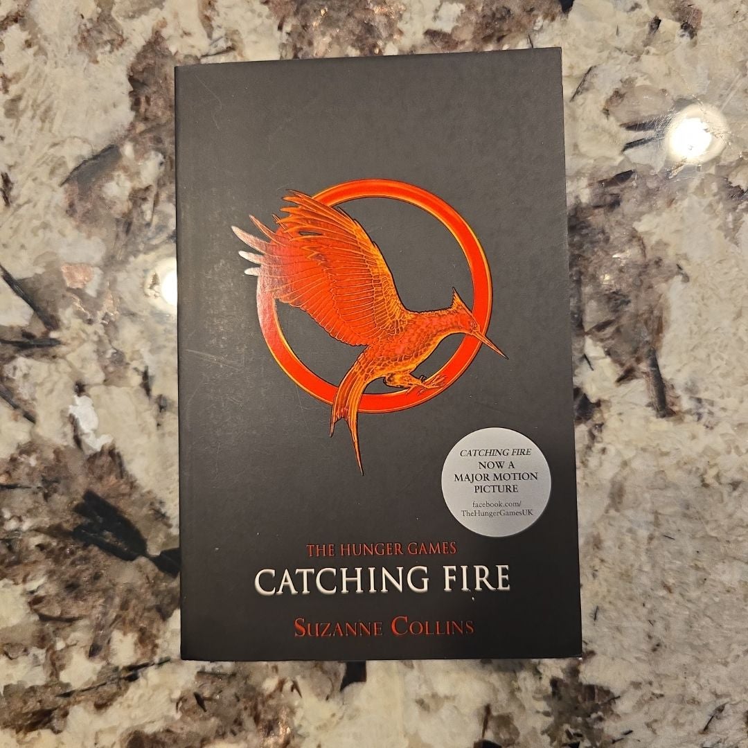 Catching Fire by Suzanne Collins, Paperback | Pangobooks