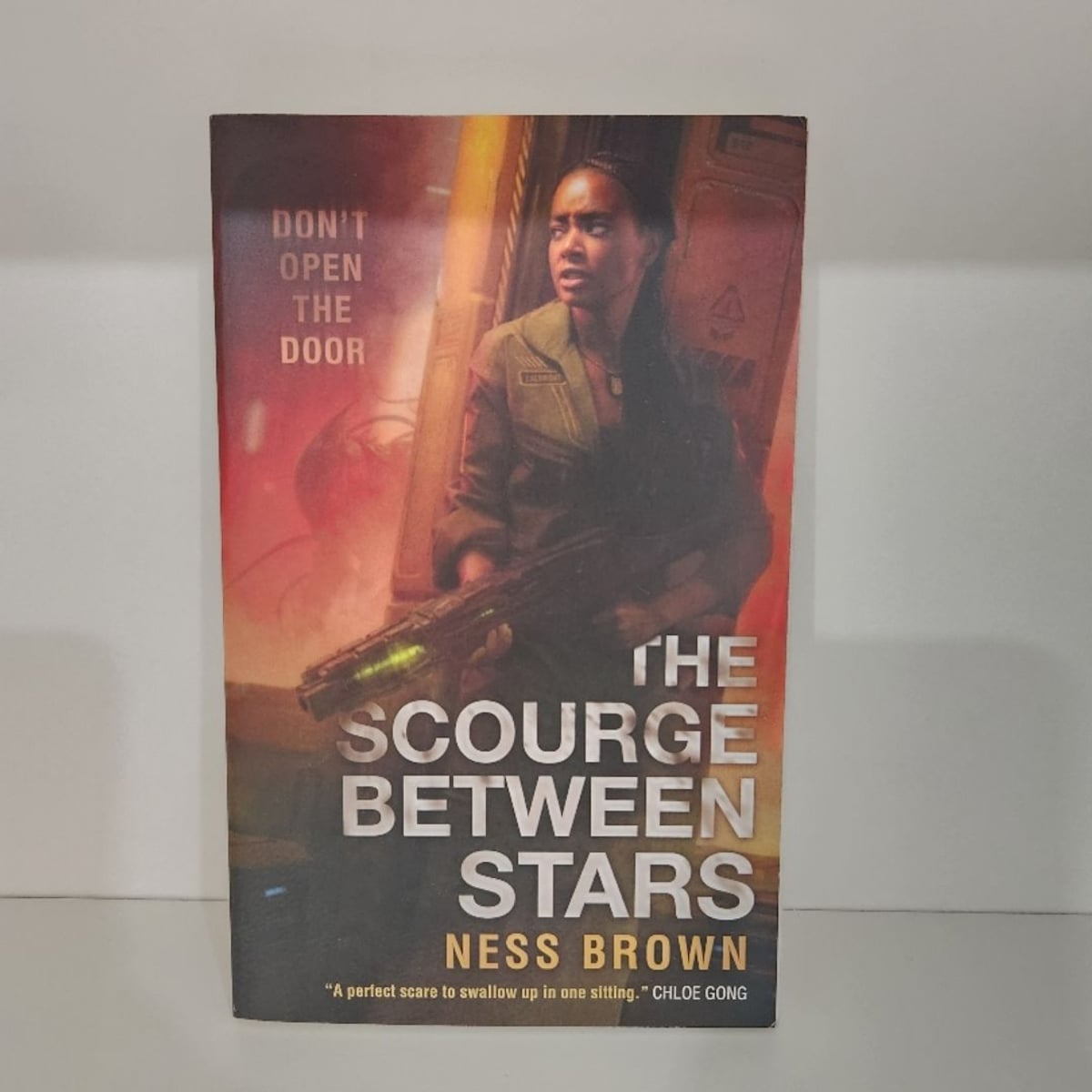 The Scourge Between Stars by Ness Brown