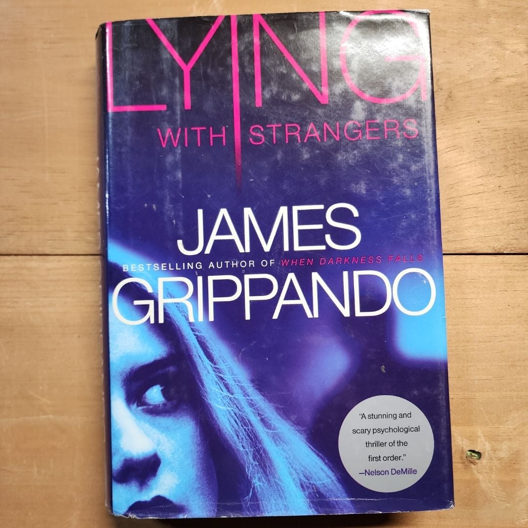 Lying with Strangers by James Grippando