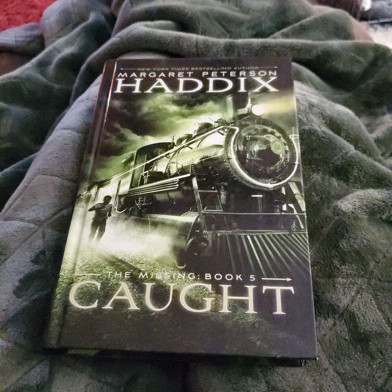 Caught by Margaret Peterson Haddix, Hardcover | Pangobooks