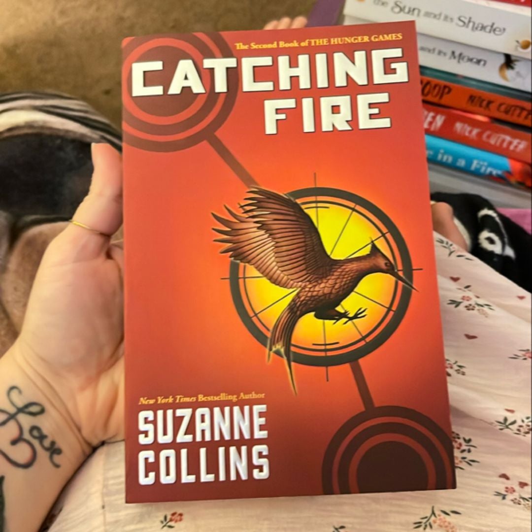 Catching Fire by Suzanne Collins, Paperback | Pangobooks