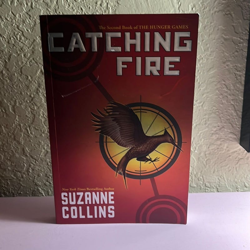 Catching Fire by Suzanne Collins , Paperback | Pangobooks