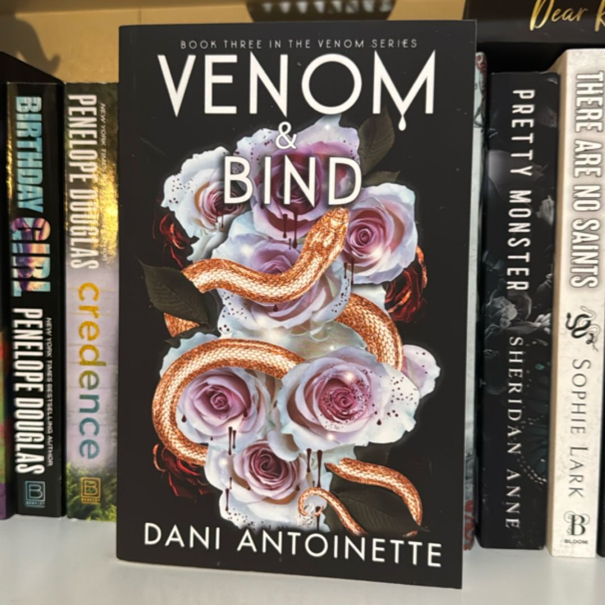 Venom and Bind: an Enemies to Lovers Romance by Dani Antoinette