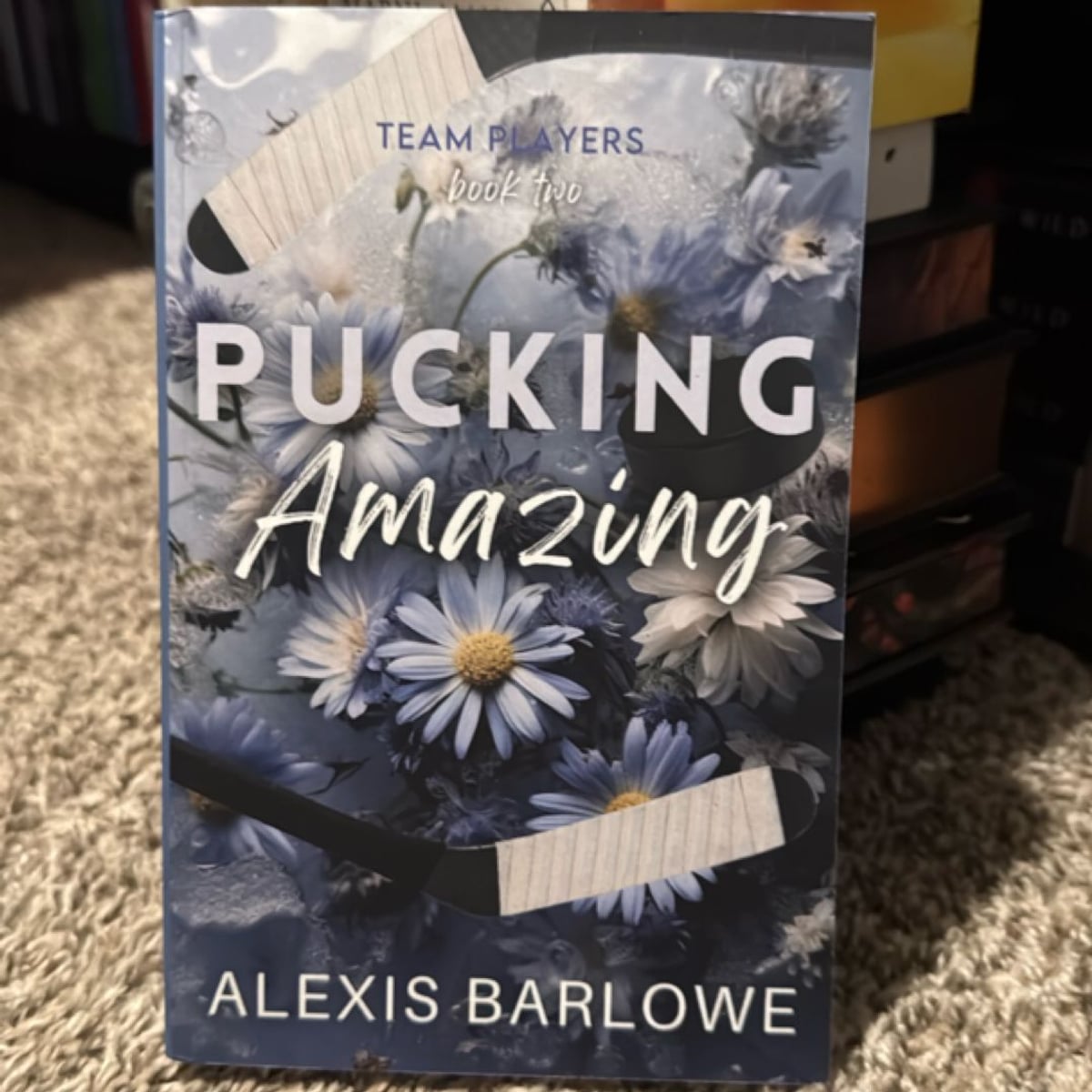 Pucking Amazing: a Why Choose Hockey Romance by Alexis Barlowe