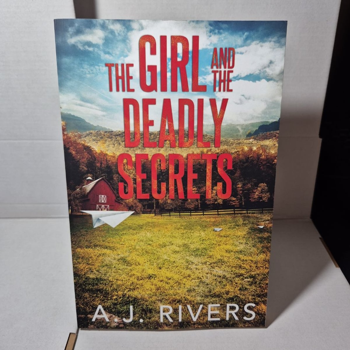 The Girl and the Deadly Secrets by A J Rivers