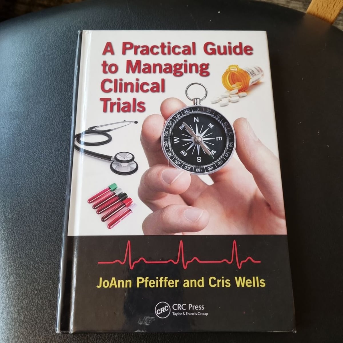 A Practical Guide to Managing Clinical Trials by JoAnn Pfeiffer, Cris Wells