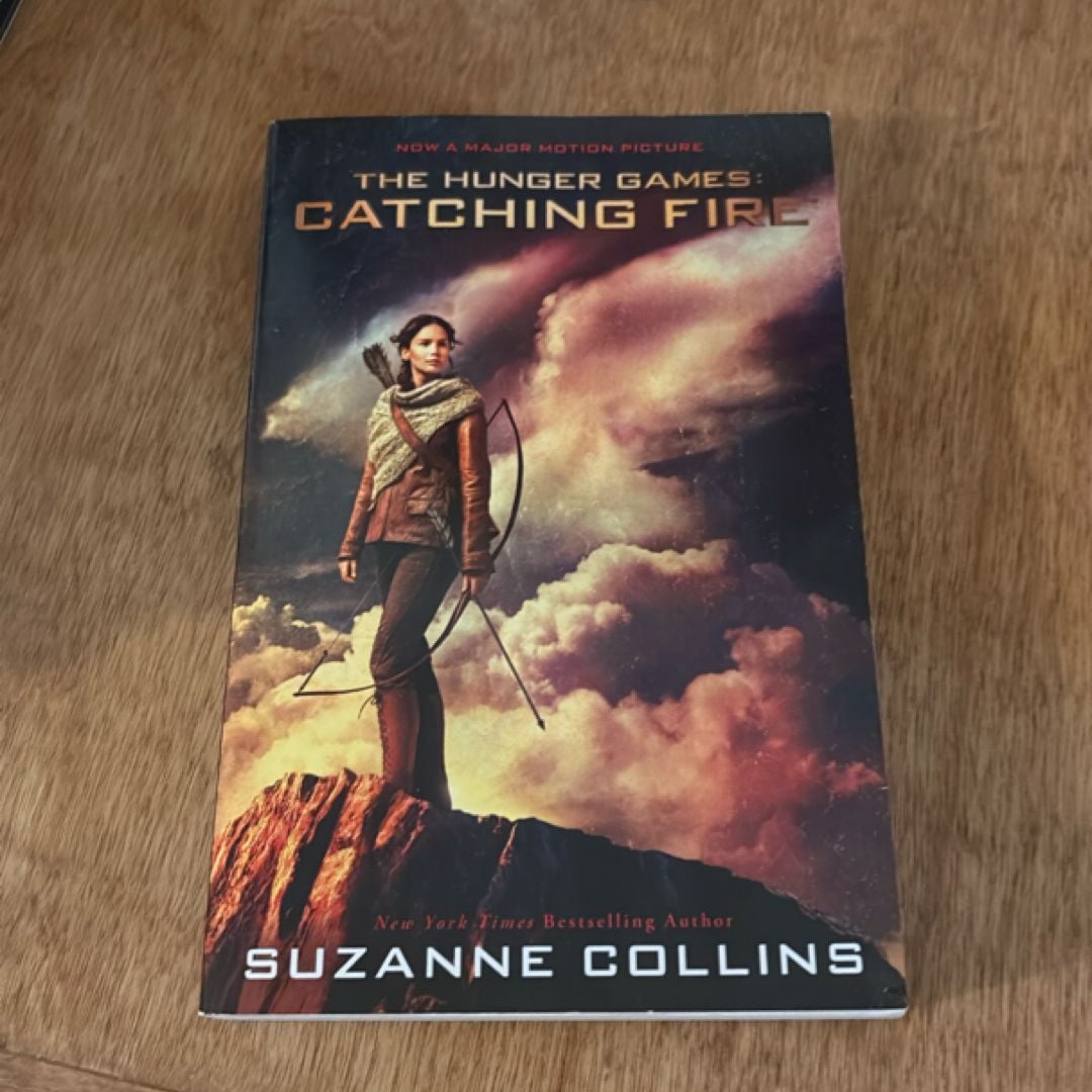 Catching Fire by Suzanne Collins, Paperback | Pangobooks