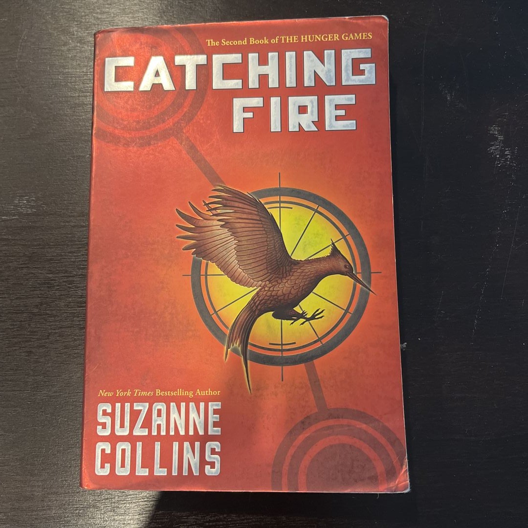 Catching Fire by Suzanne Collins, Paperback | Pangobooks