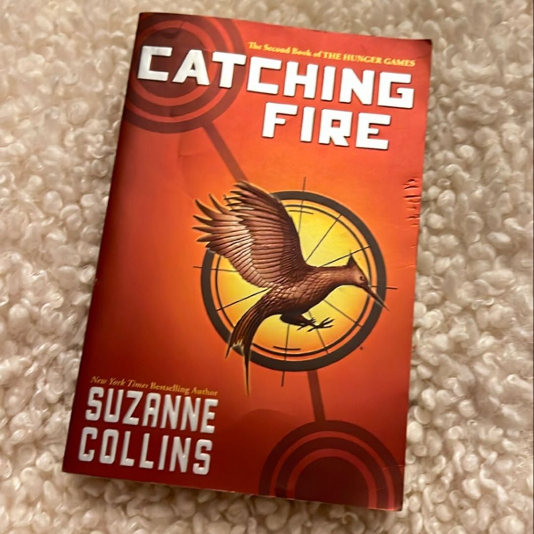 Catching Fire by Suzanne Collins, Paperback | Pangobooks