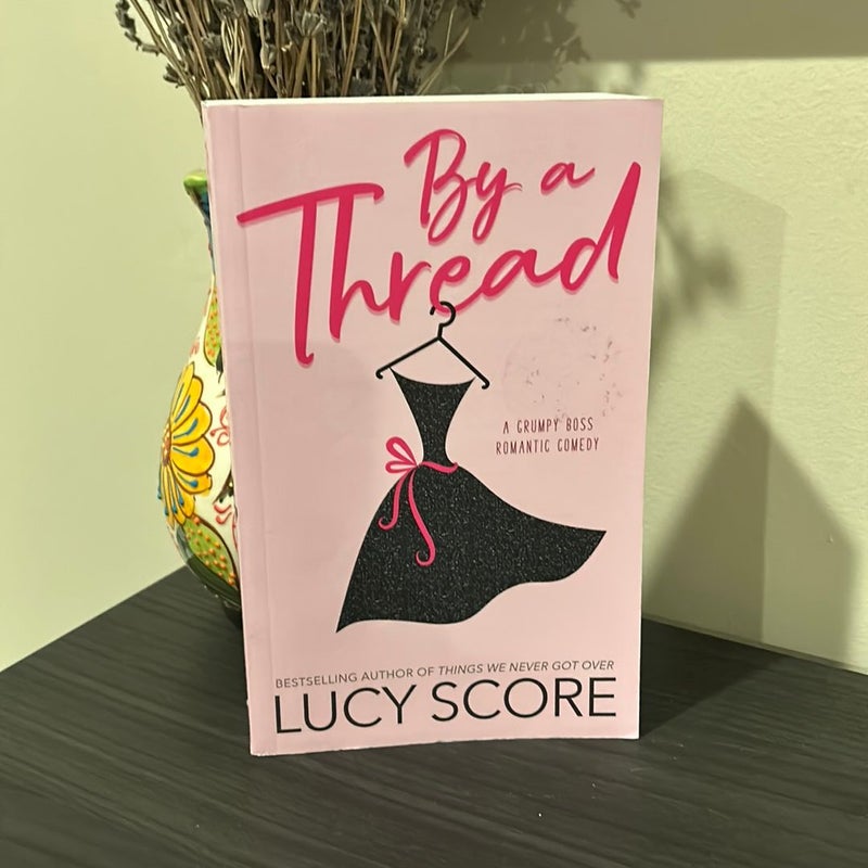 By a Thread by Lucy Score, Paperback | Pangobooks