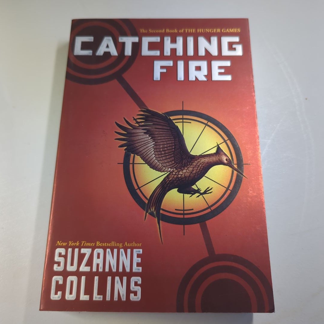 Catching Fire by Suzanne Collins, Paperback | Pangobooks