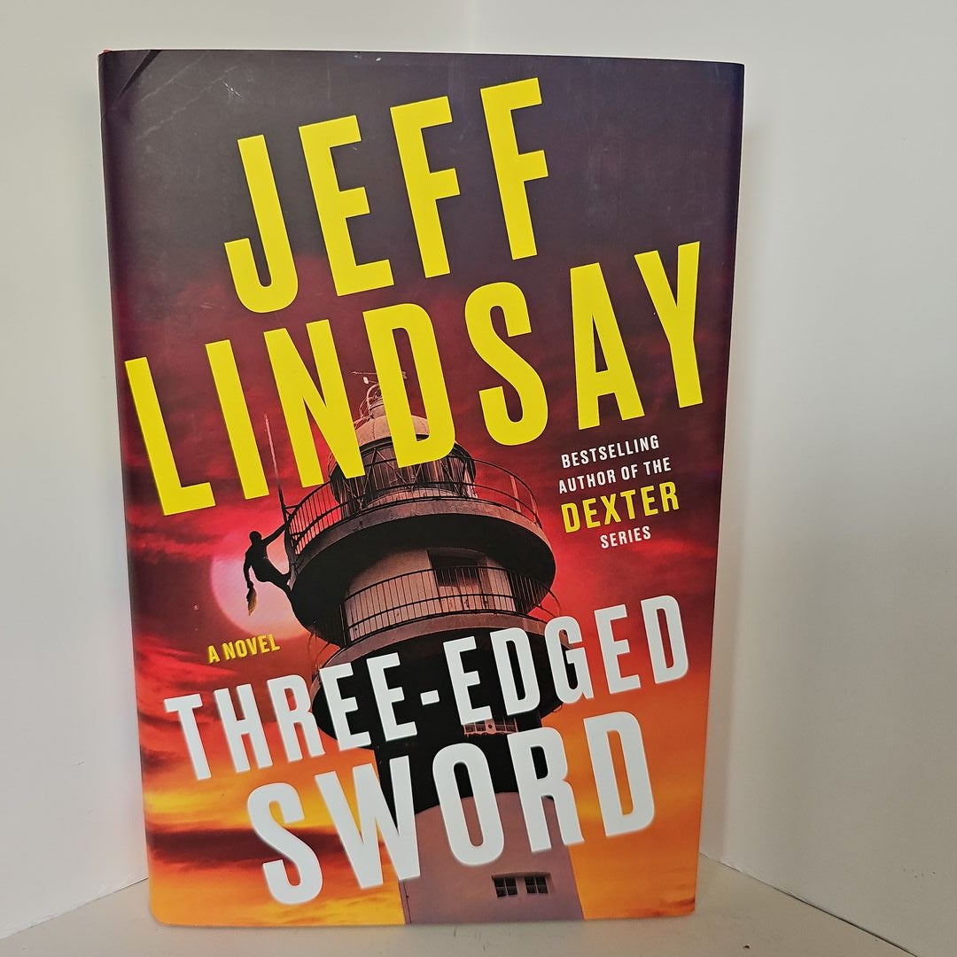 Three-Edged Sword by Jeff Lindsay