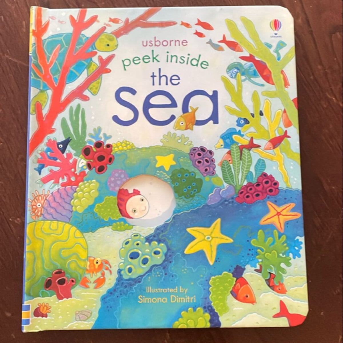 Peek Inside the Sea by Anna Milbourne