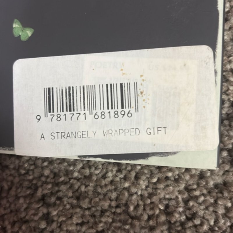 A Strangely Wrapped Gift by Emily Juniper
