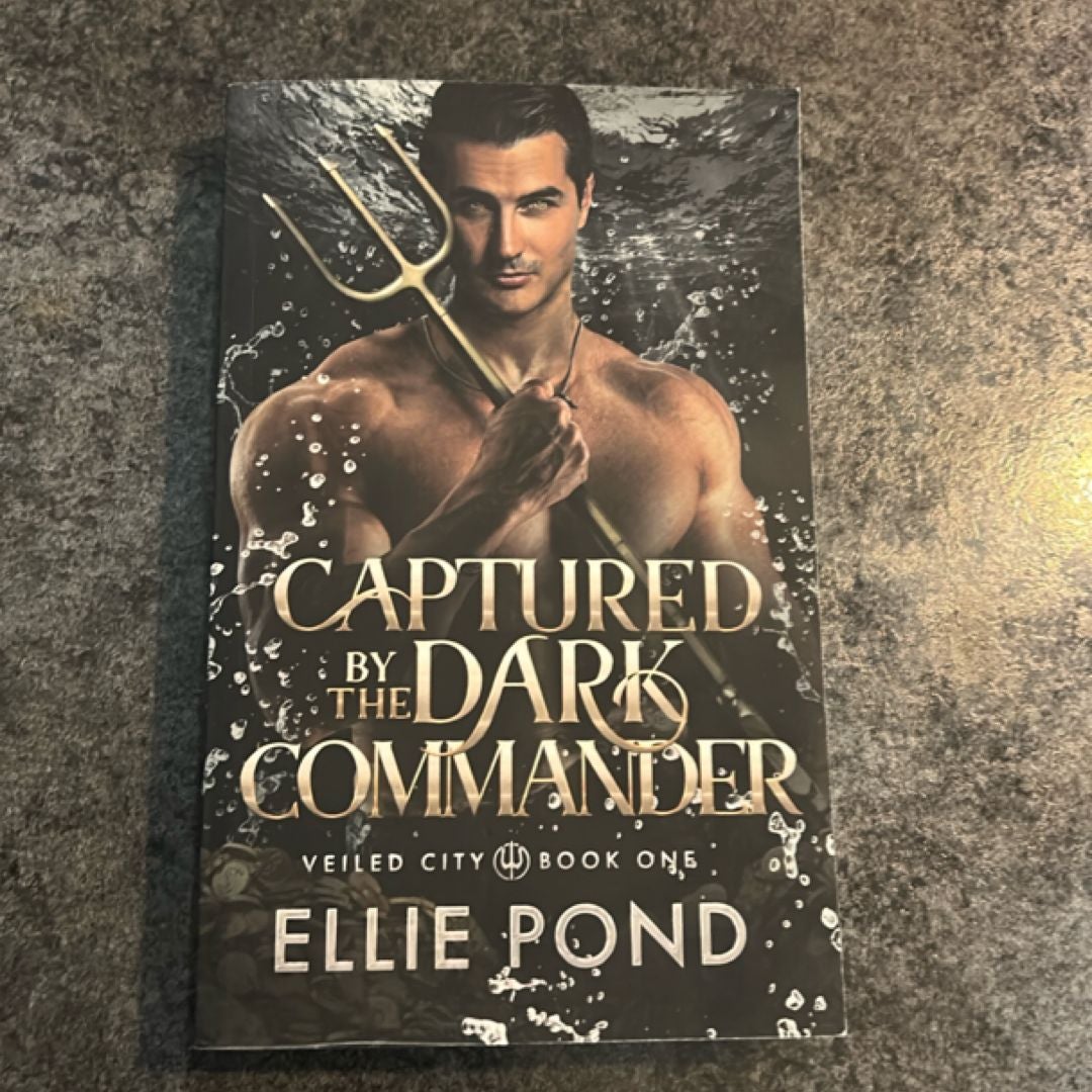 Captured by the Dark Commander by Ellie Pond