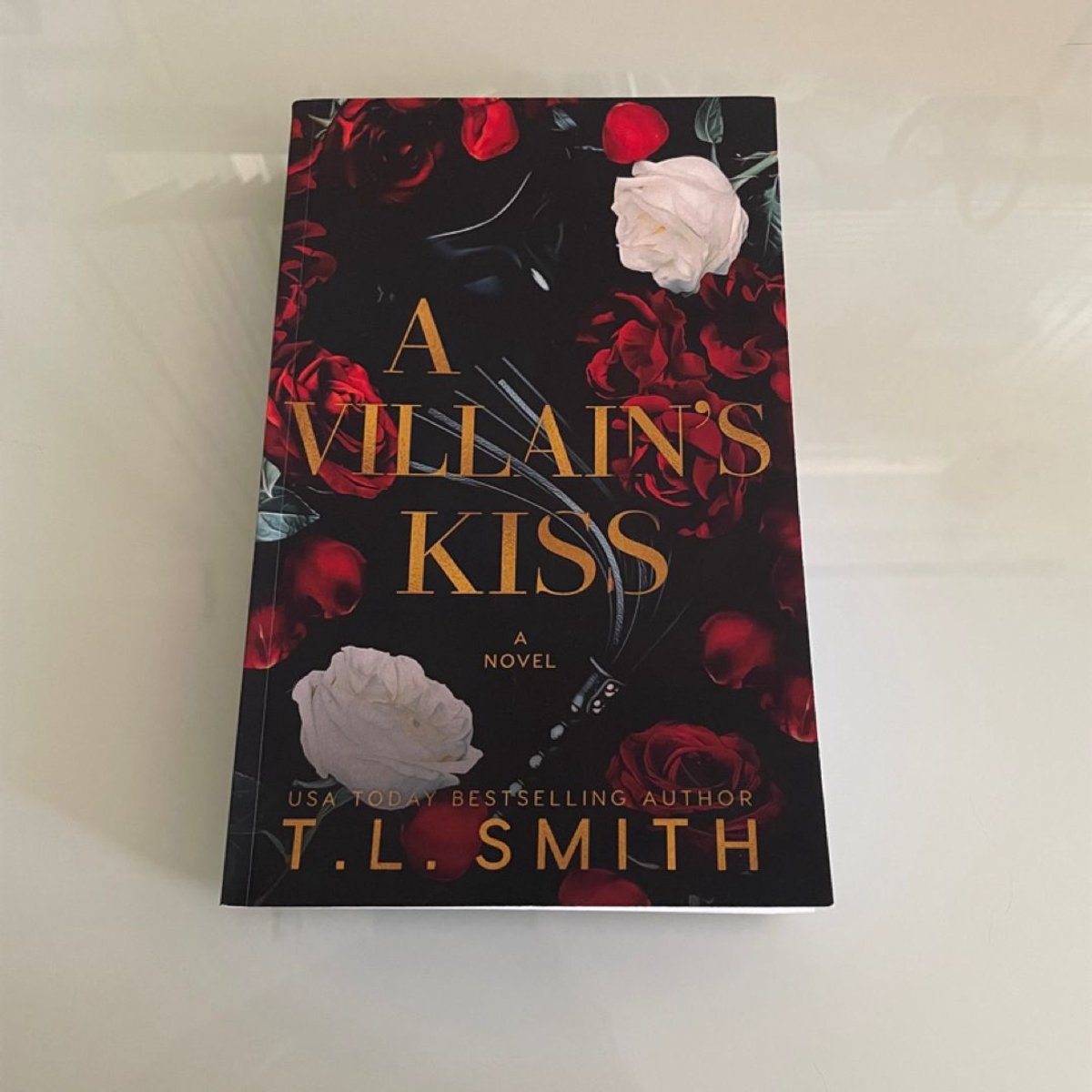 A Villain's Kiss by T. L. Smith